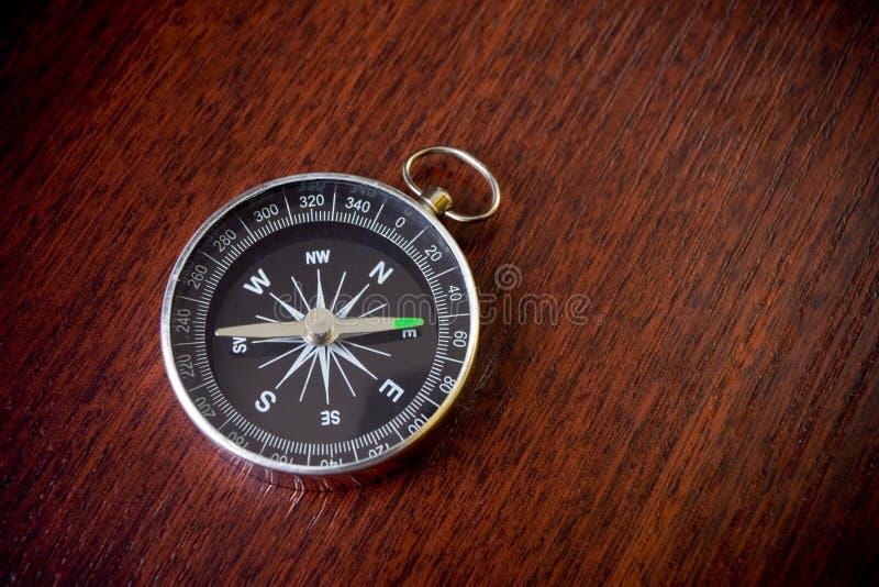 Compass on Brown Wooden Background. Stock Image - Image of background ...