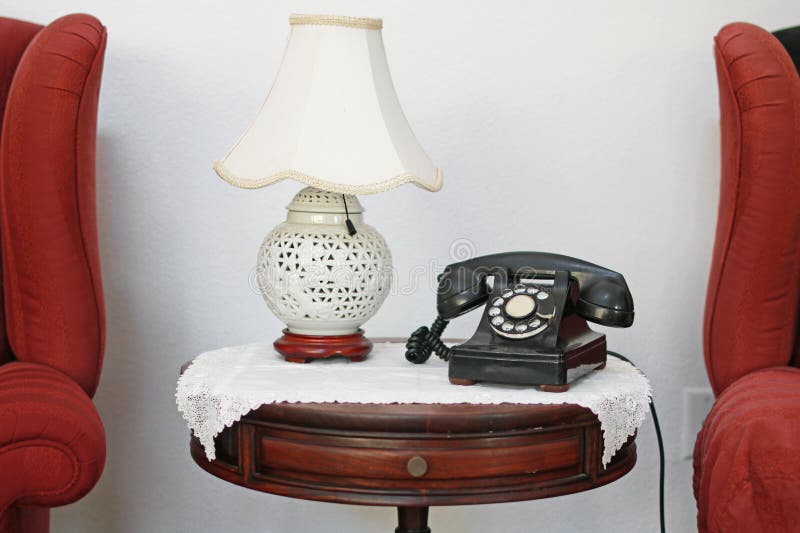Retro Dial Phone, Decorative Lamp on Round Chair Side Table Stock Photo ...