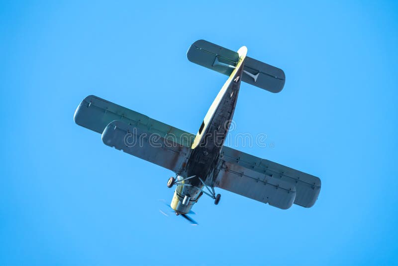 Retro Green Biplane Plane in the Blue Sky Stock Photo - Image of ...