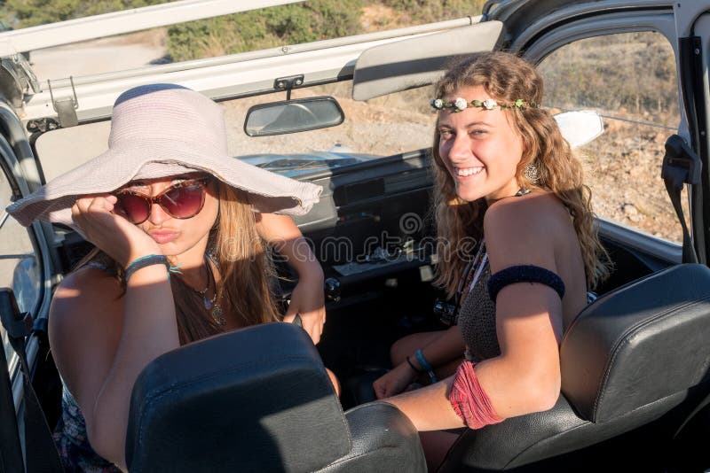 Friends in a car at sunset stock photo. Image of smile - 118848126