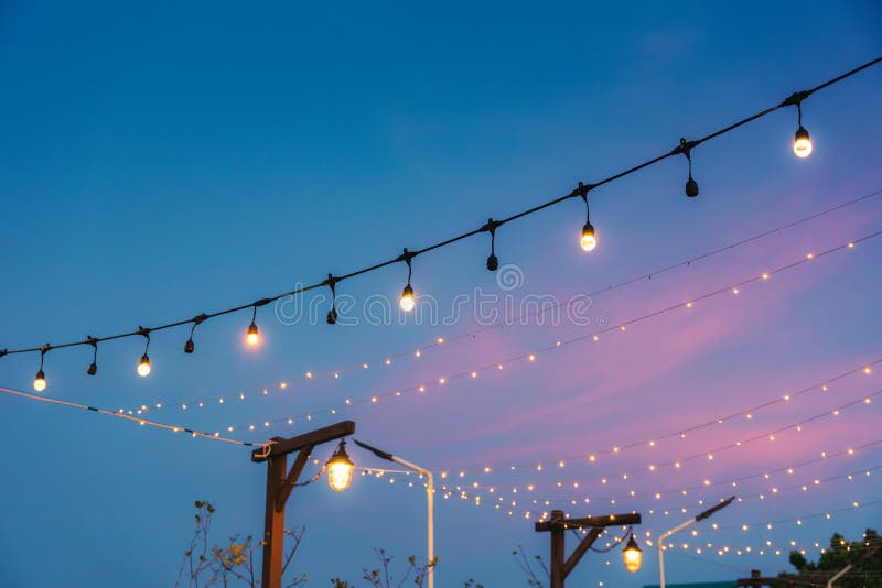 Retro Light Bulb Glowing from String Hanging Decorative on Celebration ...