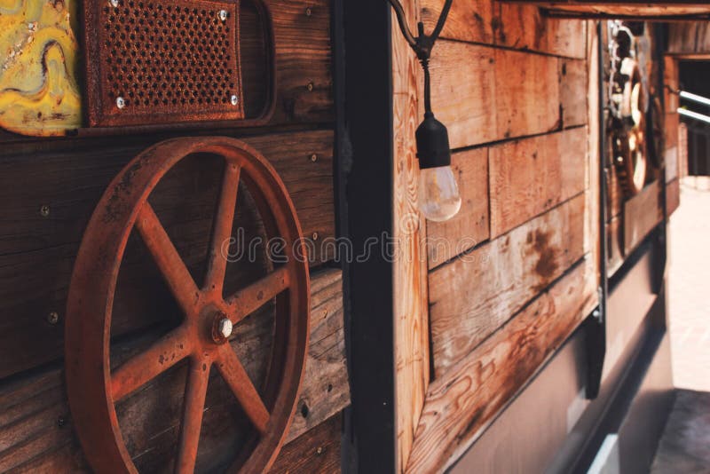 Retro Lightbulb, Rustic Wood Board, Rusty Iron Wheel Decor Stock Photo ...