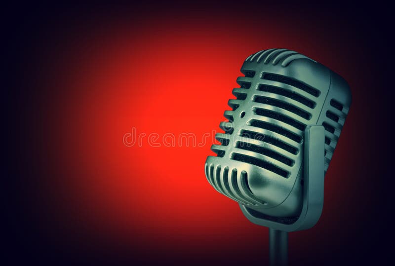 Retro Dynamic Microphone on a Blue Studio Background Stock Photo ...