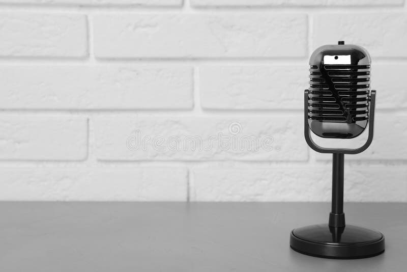 Retro Microphone on Table Near Wall. Space for Text Stock Photo - Image ...