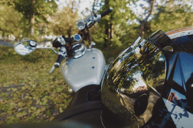A Retro Motorcycle Stands Against the Backdrop of Autumn Leaves Stock ...