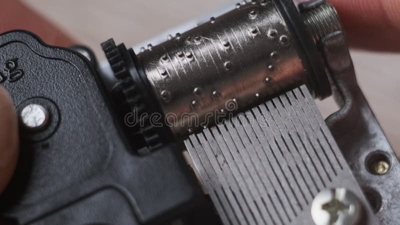Retro Music Box Mechanism with Spinning Cylinder and Cogs in Macro ...