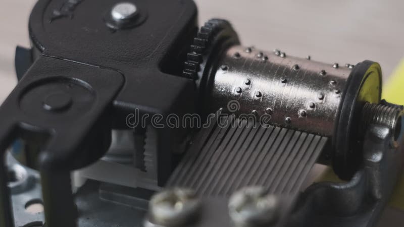 Retro Music Box Mechanism with Spinning Cylinder and Cogs in Macro ...