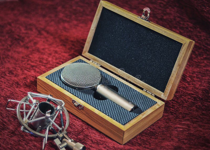 Retro Ribbon Microphone on a Wooden Box and Red Background Stock Photo ...