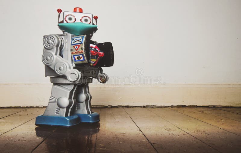 Retro Robot with a Mask on a Old Wooden Floor with Copyspace Stock ...