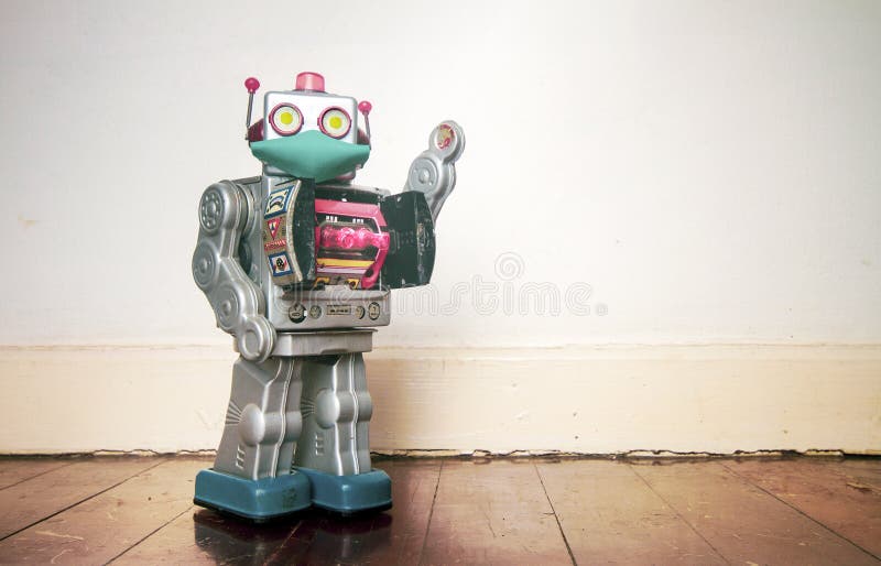 Retro Robot with a Mask on a Old Wooden Floor with Copyspace Stock ...
