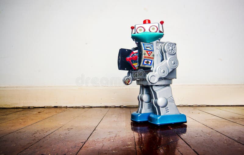 Retro Robot with a Mask on a Old Wooden Floor with Copyspace Stock ...