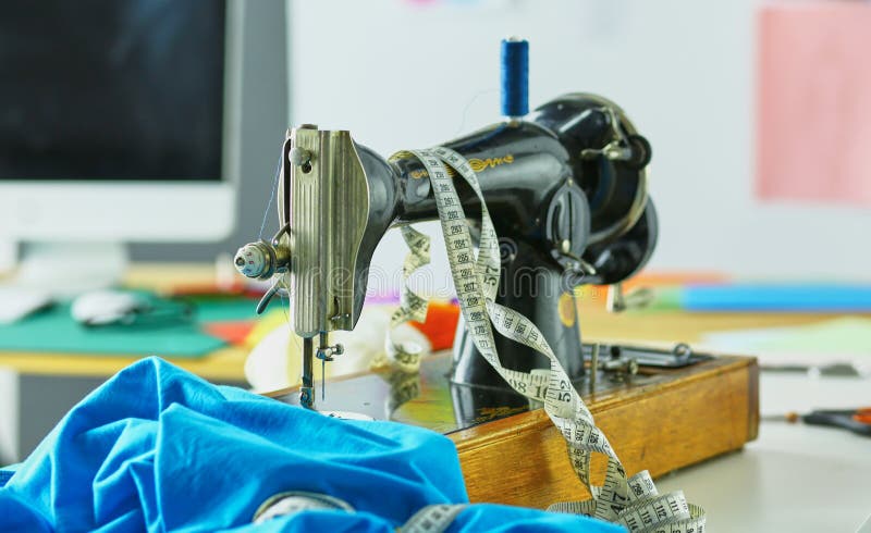 Retro Sewing Machine on Designer Clothes Desktop Stock Image - Image of ...