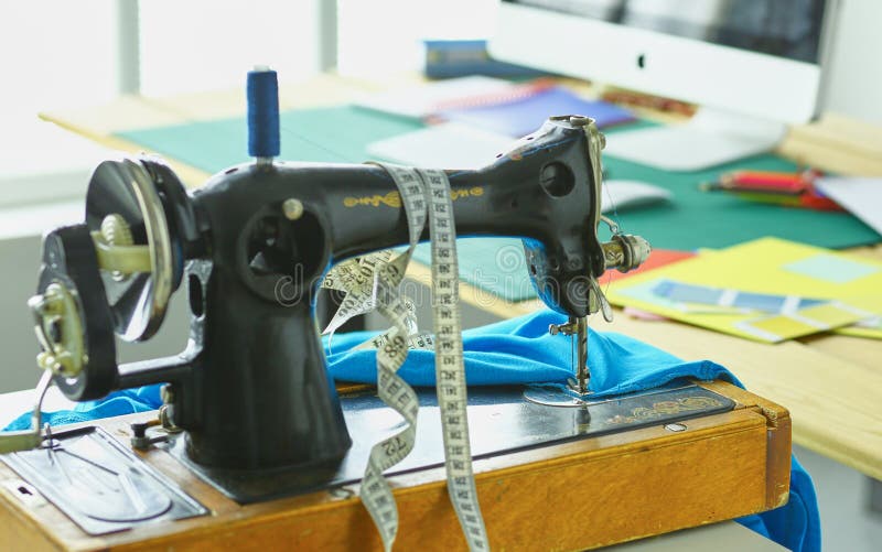Retro Sewing Machine on Designer Clothes Desktop Stock Photo - Image of ...