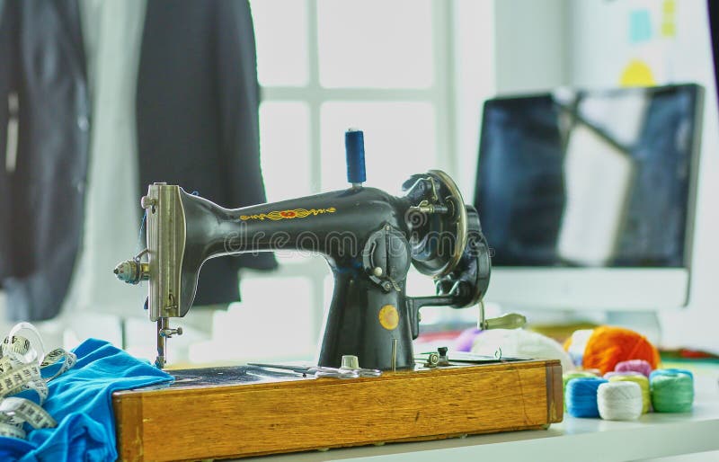 Retro Sewing Machine on Designer Clothes Desktop Stock Photo - Image of ...