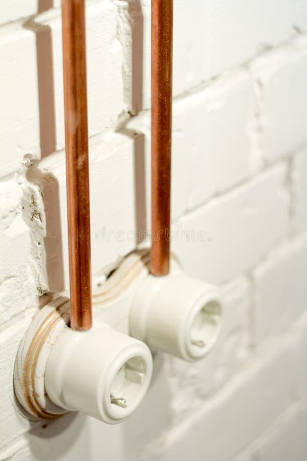 A Vintage Outlet and Electrical Wiring in a Copper Tube. Stock Photo ...