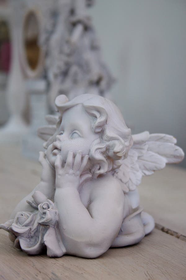 Retro Statuette of an Angel on a Wooden Table. Stock Image - Image of ...
