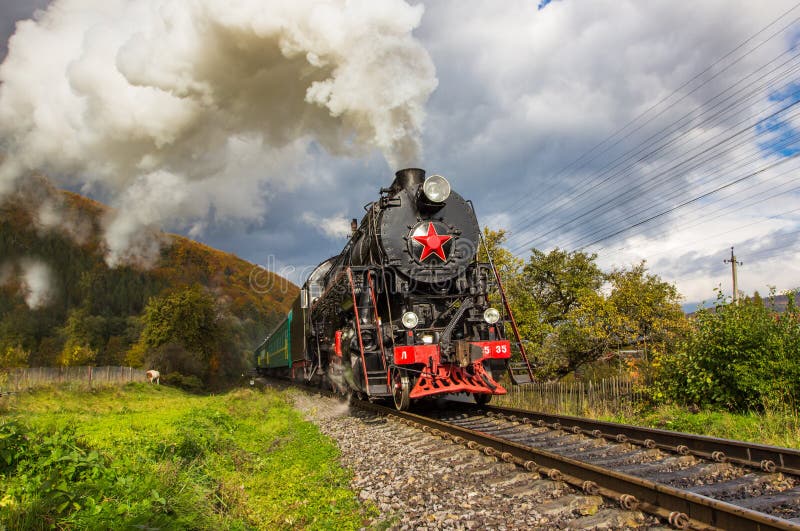 Retro Steam Train Approaches Mountains Stock Image - Image of railroad ...