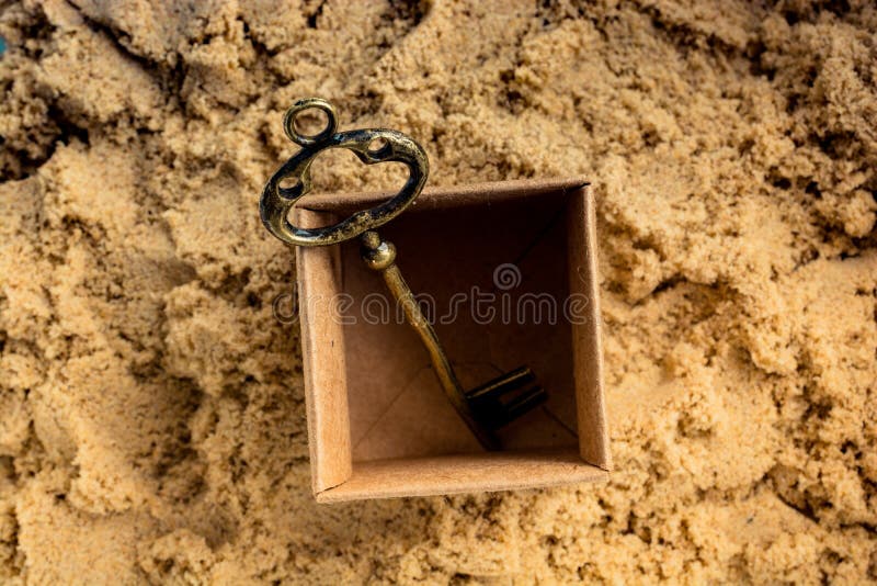 Retro Style Key in a Brown Box on Sand Stock Photo - Image of golden ...