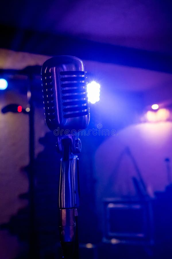 Retro Style Microphone on Stage Lights Background Stock Image - Image ...