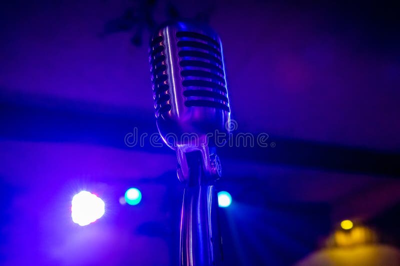 Retro Style Microphone on Stage Lights Background Stock Image - Image ...