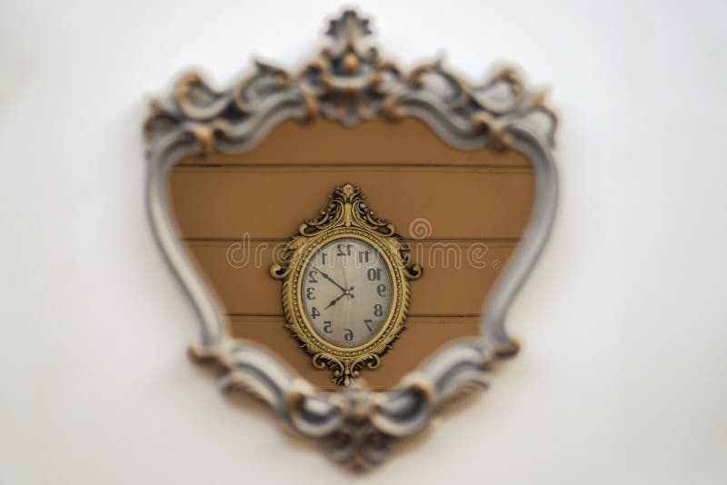 Retro Style Wall Clock Reflection Inside a Mirror on a Wall Stock Photo ...