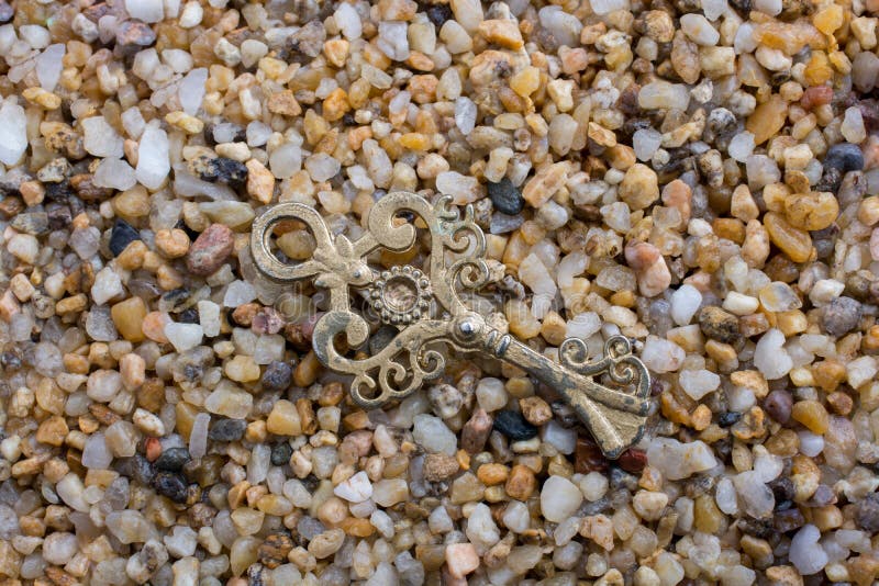 Retro Styled Decorative Key on Sand Texture Stock Image - Image of ...