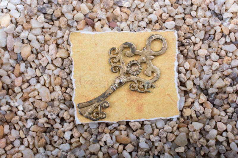Retro Styled Decorative Key on Sand Texture Stock Photo - Image of ...