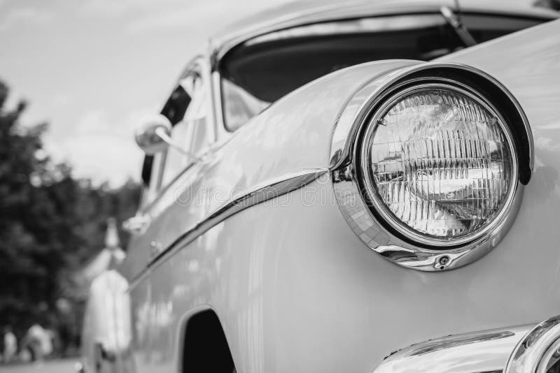 Retro-styled Front of a Classic Car with Round Headlights in Black and ...