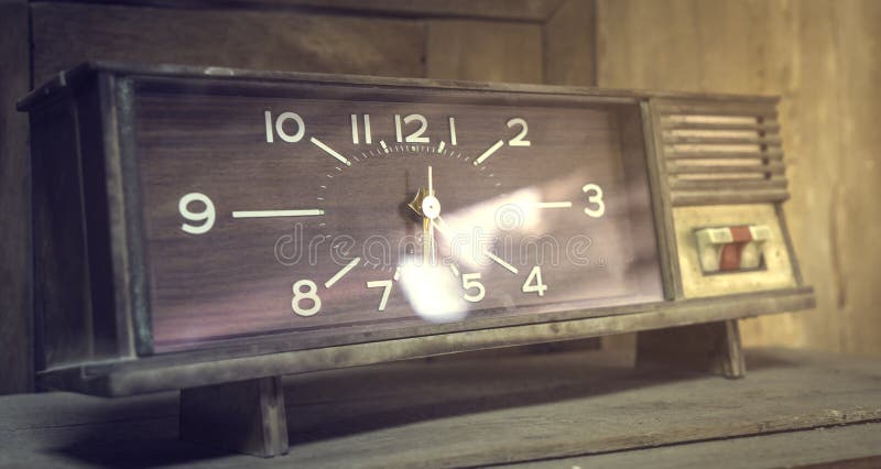 Retro Styled Image of Vintage Square Table Clock on a Wooden Table ...