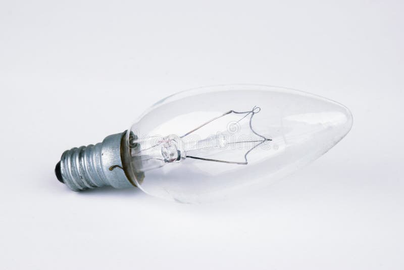 Switched Off Bulb and Black Cap Over a White Wall Stock Image - Image ...