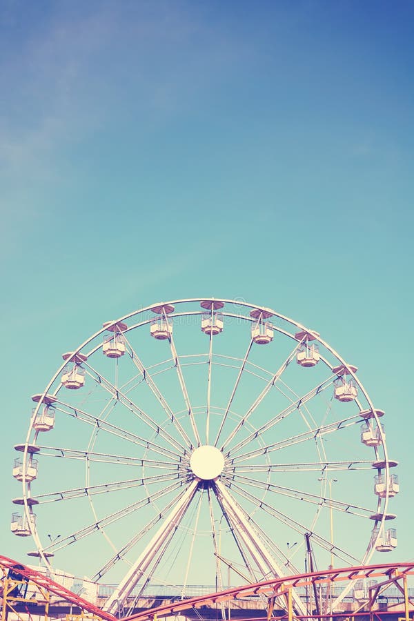 Retro Toned Picture of an Amusement Park. Stock Image - Image of ...