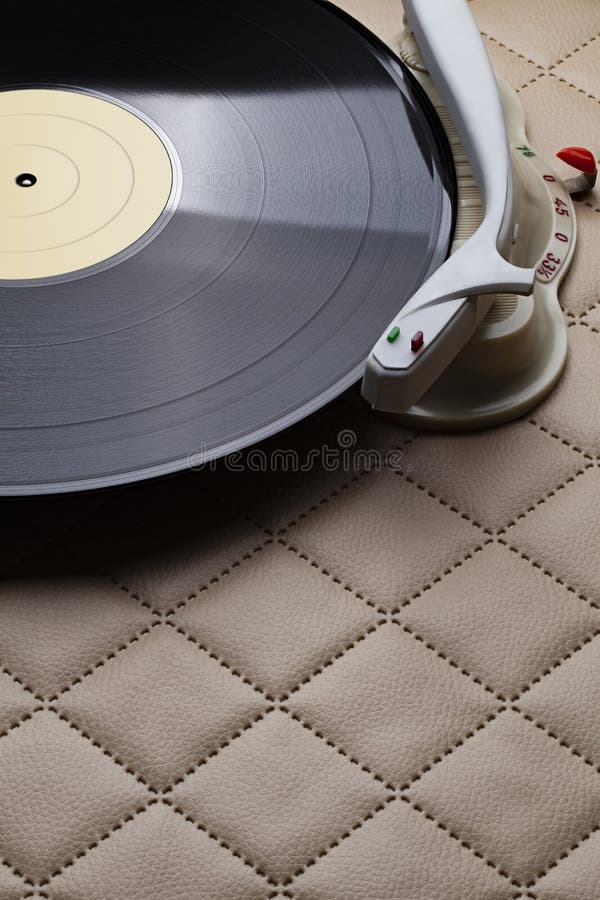 Retro Vinyl Player with Classic Vinyl Record on Leather Background ...