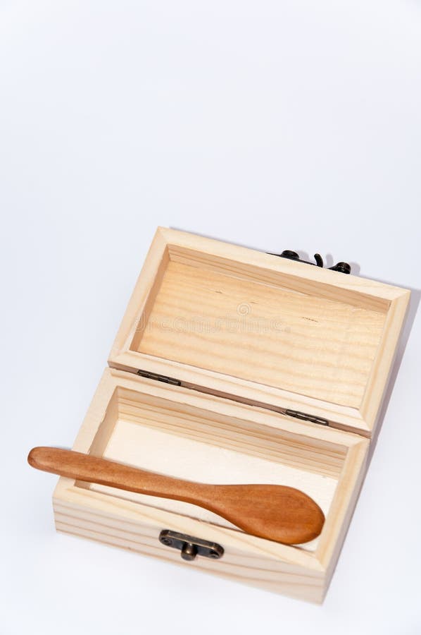 Retro Wooden Box with a Wooden Spoon Over White Surface Stock Image ...