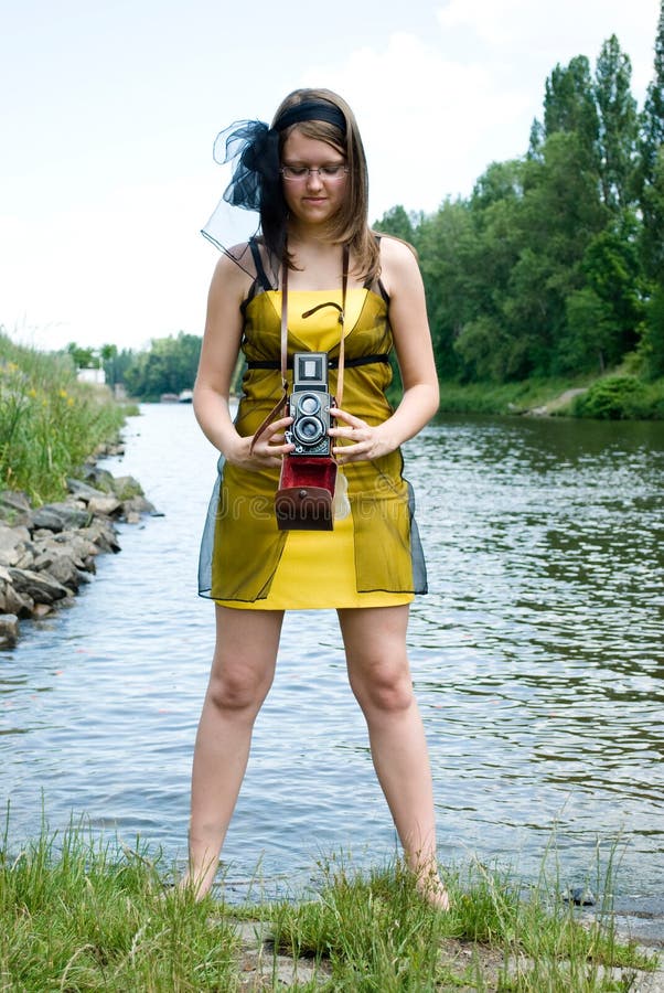Retro Young Woman with Camera Near the River Stock Image - Image of ...