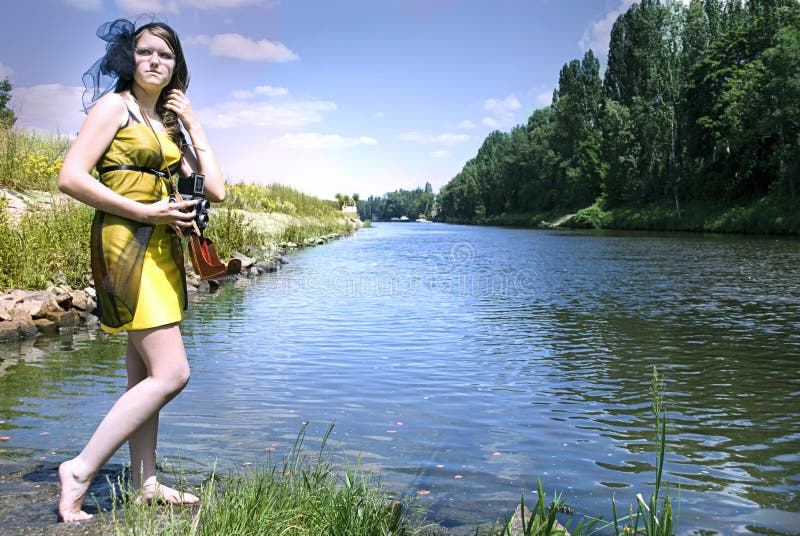 Retro Young Woman with Camera Near the River Stock Image - Image of ...