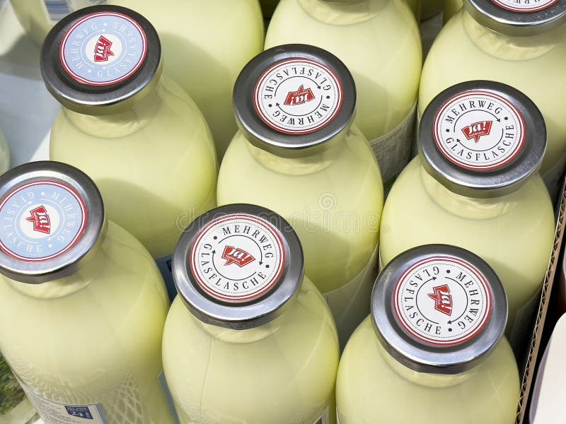 Reusable Glass Milk Bottles with Metal Caps in Bulk Display Editorial ...