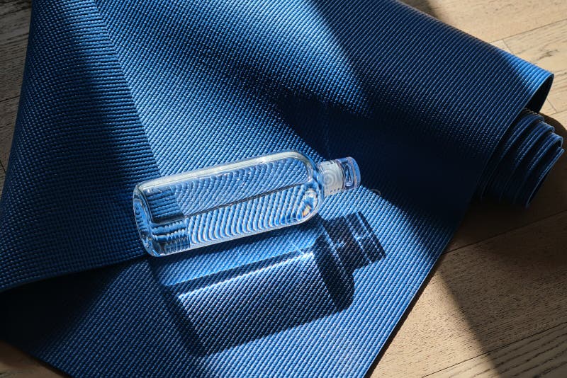 Reusable Glass Water Bottle on Yoga Mat. Stock Photo - Image of ...