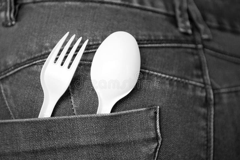 Take Out Food Concept with Blue Denim Jeans with a White Fork and Spoon ...