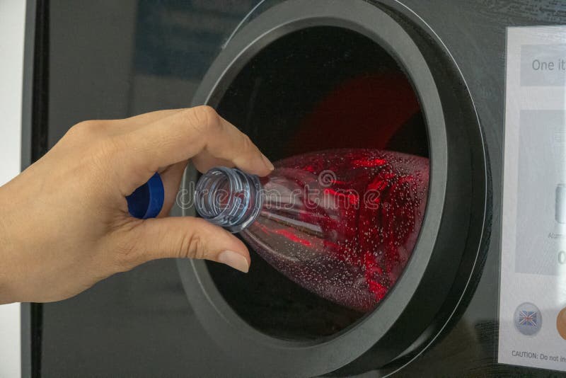 Reverse Vending Machine. Woman Hand Put Empty Plastic Bottle in the ...