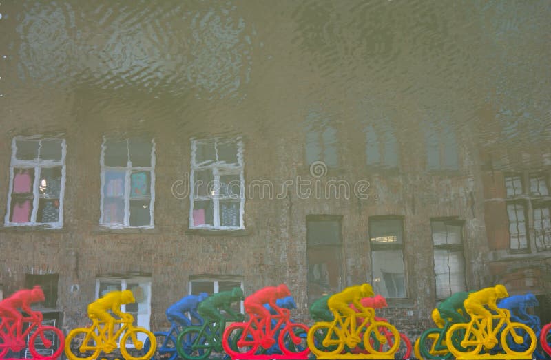 Reversed Image Concept: Plastic Cyclists on a River Stock Photo - Image ...