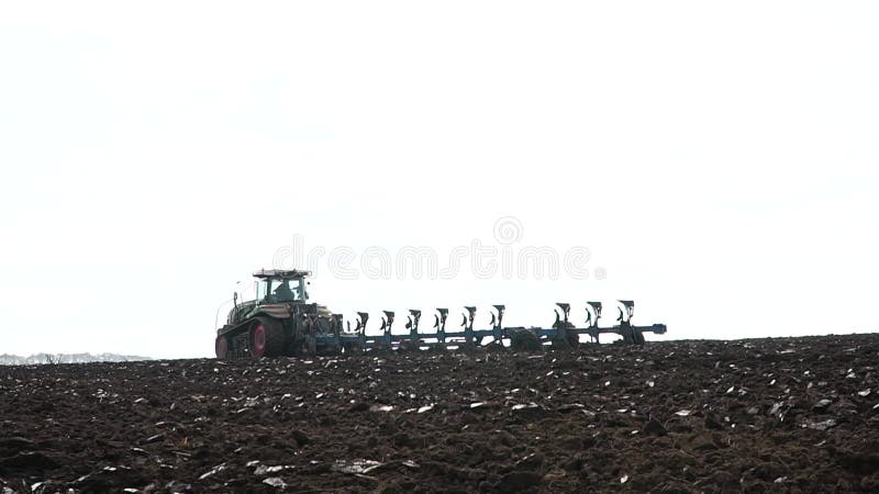 Reversible Cultivator. Tractor Working on the Field Doing Tillage with ...