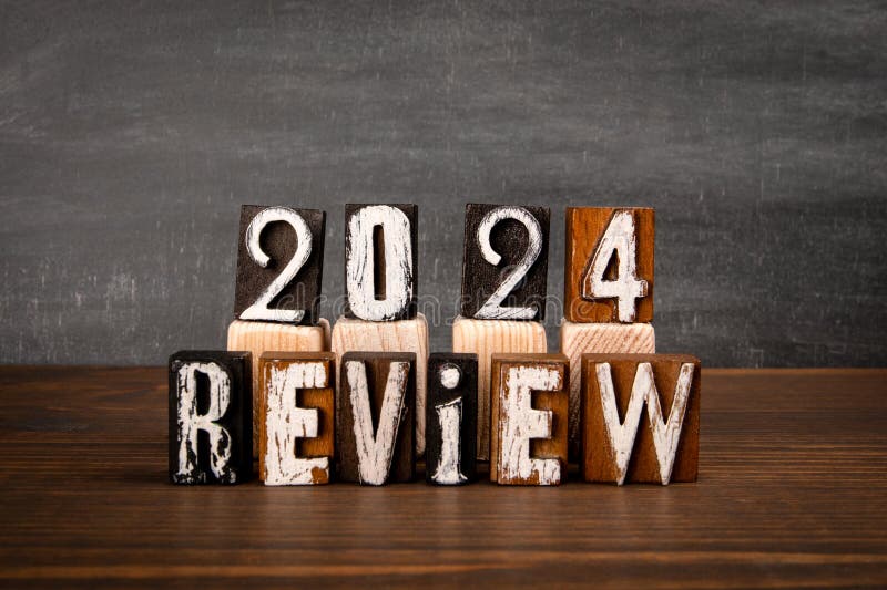 2024 Review. Alphabet Blocks on Wooden Texture Table Stock Image ...