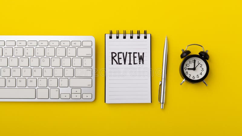 Review and Assessment Concept with Computer Keyboard and Clock on ...