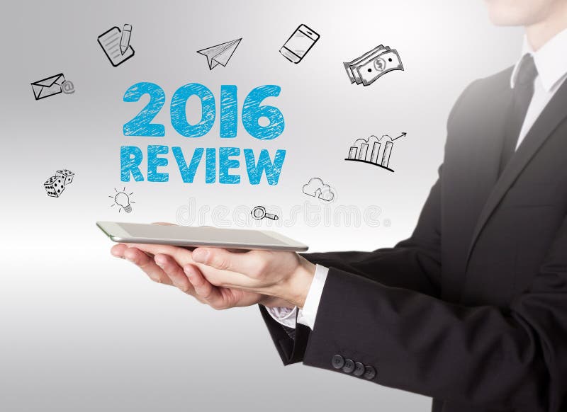 2016 Review Concept, Young Man Holding a Tablet Computer Stock Image ...