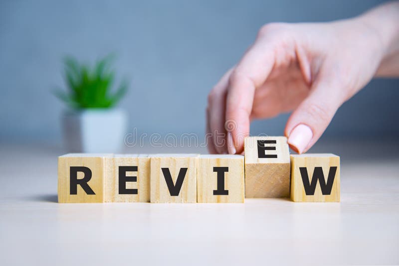 Review Headline Sign Made of Wood on a Blue Background Stock Image ...