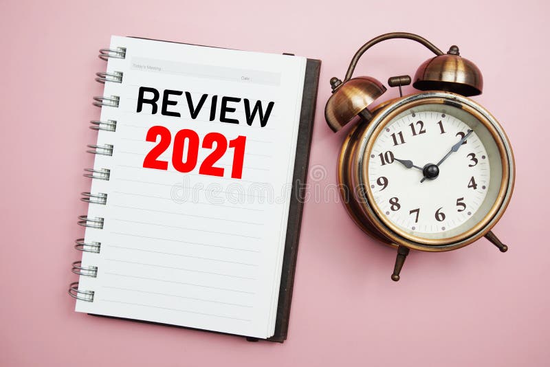 Review 2021 Text with Alarm Clock on Pink Background Stock Image ...
