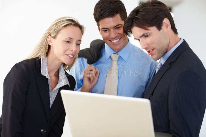 Reviewing the Data Together. a Group of Business Colleagues Using a ...