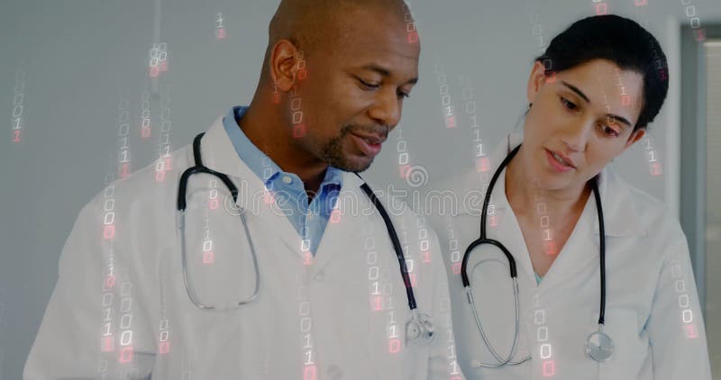 Reviewing Information, Doctors with Binary Code Animation Overlay in ...