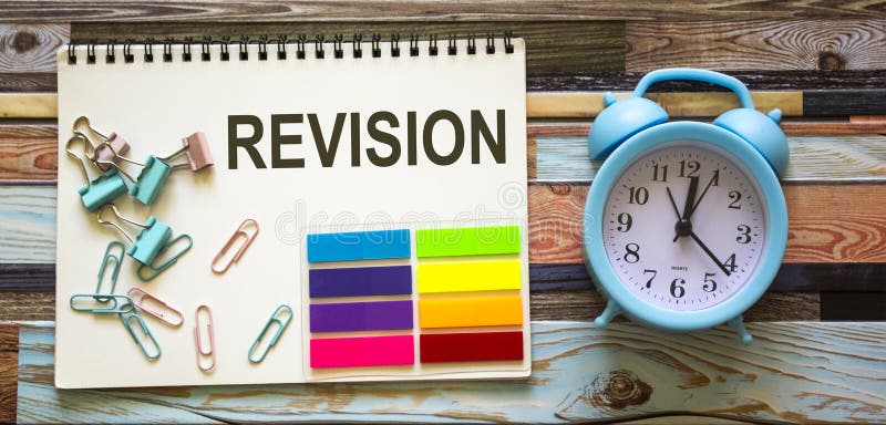 Revision, Text on a White Notepad, Paper Clips, Stickers and an Alarm ...