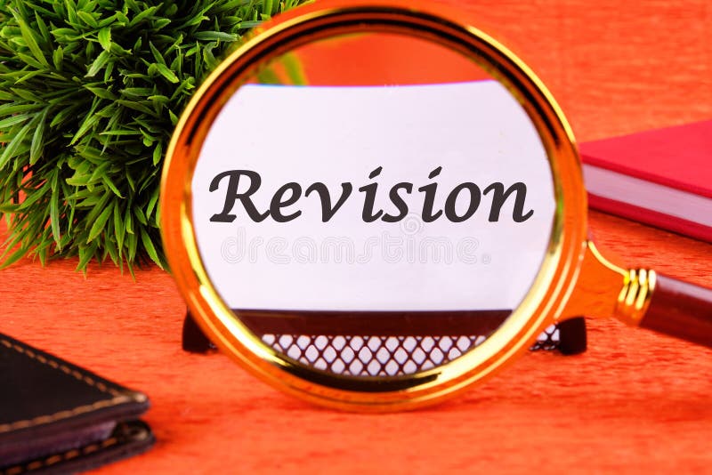 Revision Word through a Magnifying Glass on a Business Card. Business ...